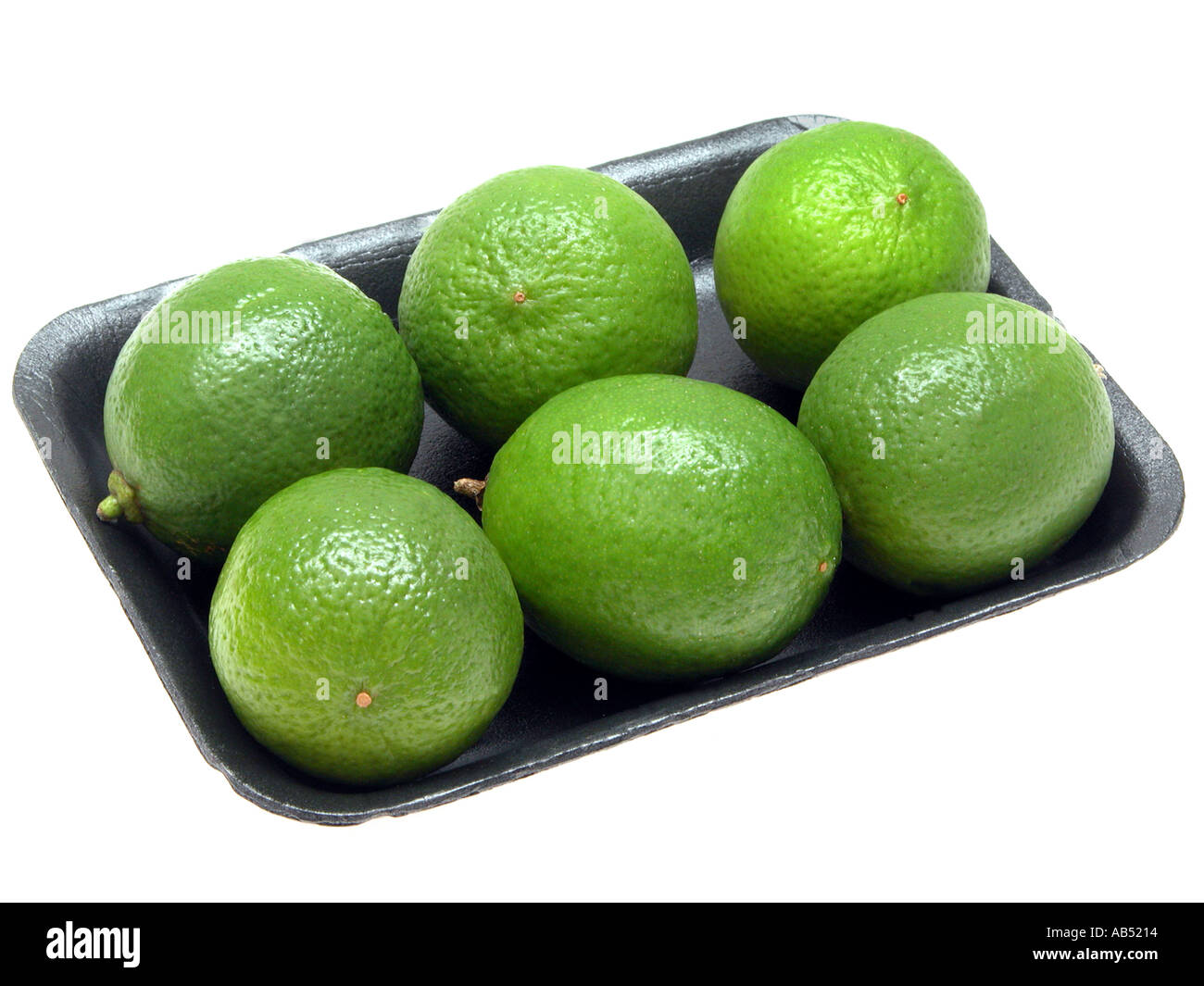 limes in a pack green limes lemon cut out cutout Stock Photo - Alamy
