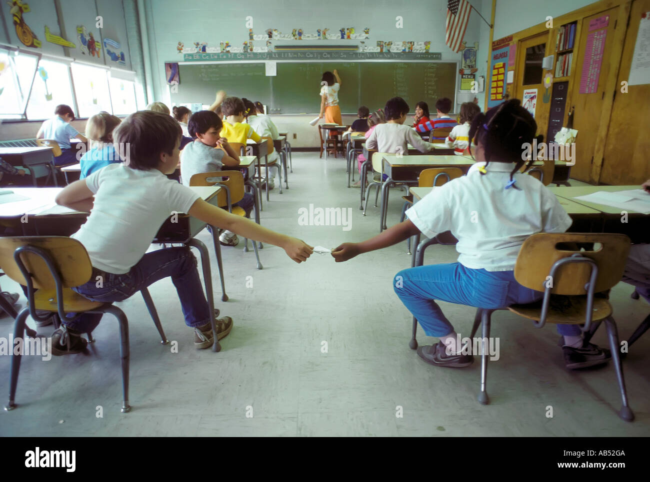 Kids passing note class hi-res stock photography and images - Alamy