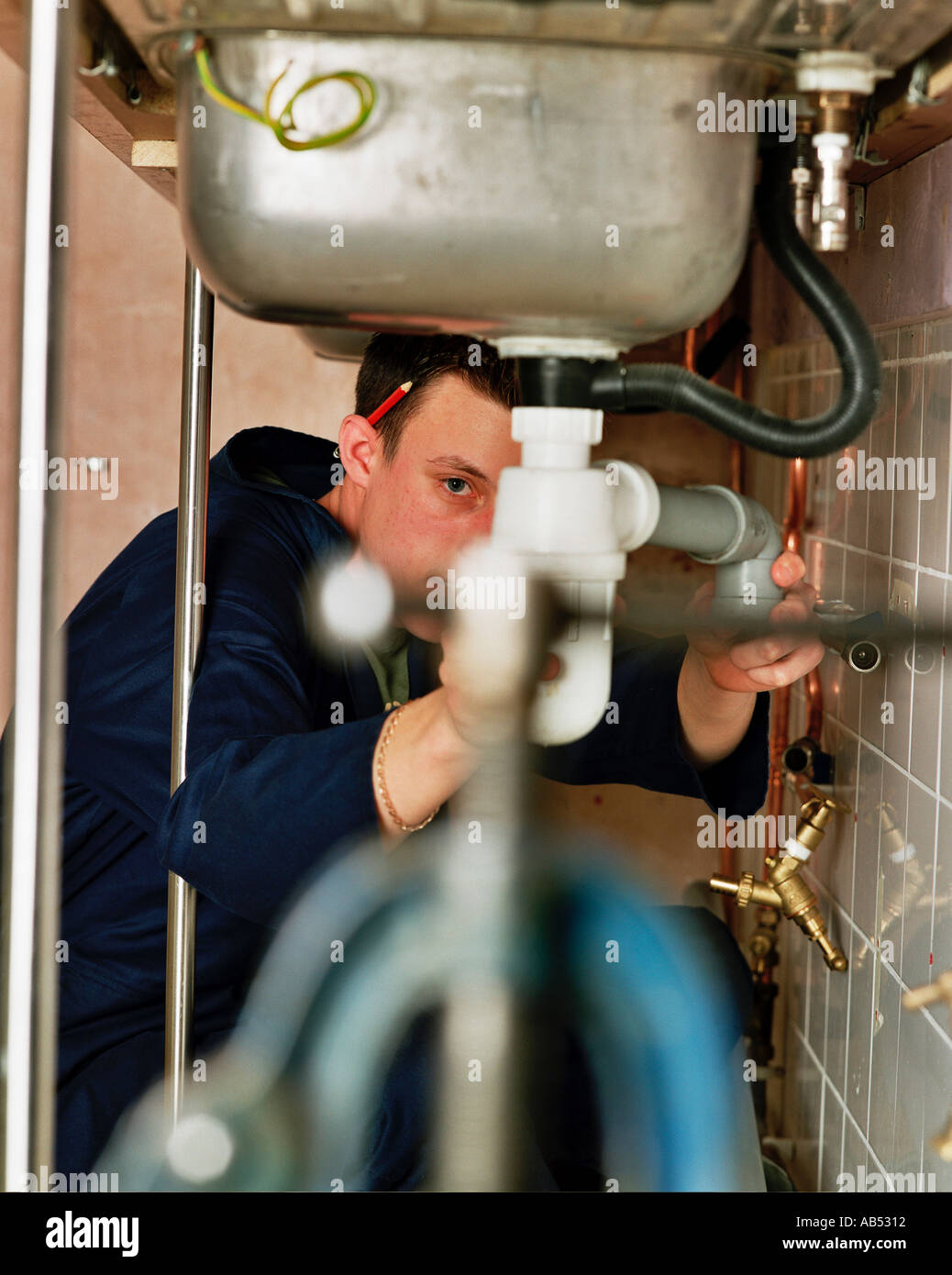 plumber looking for the leak Stock Photo - Alamy