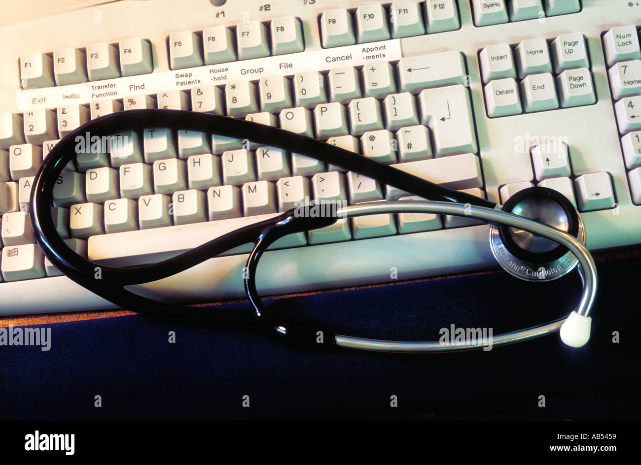 Medical doctors desk with computer keyboard and stethoscope general ...