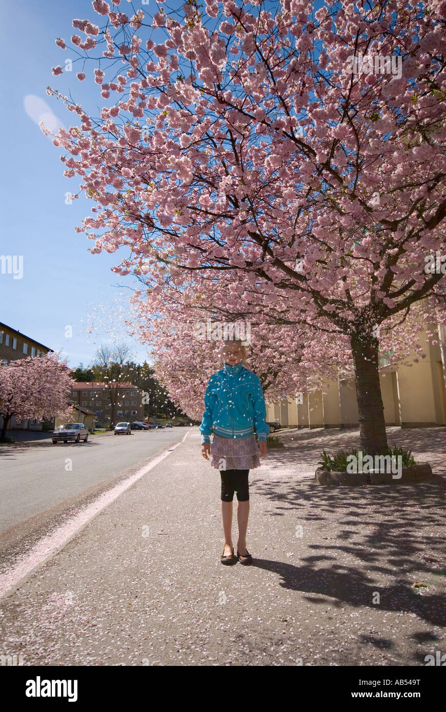Young girl under spring trees Stock Photo - Alamy