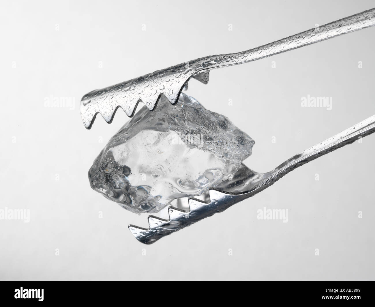 ICE IN TONGS Stock Photo - Alamy