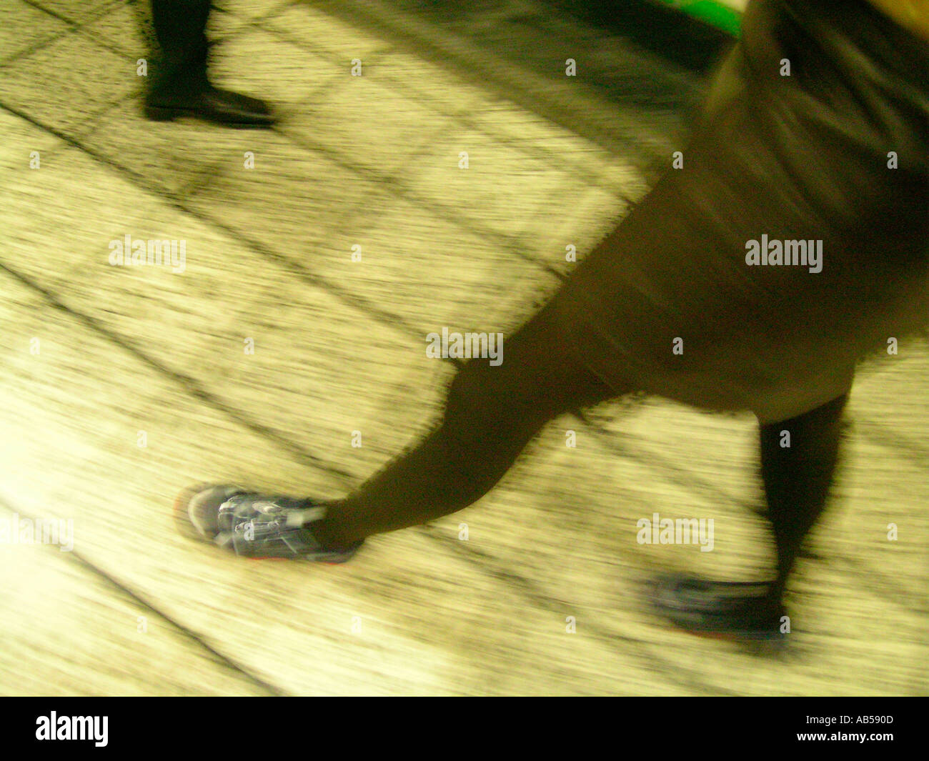 close up of woman's legs walking on pavement, London Stock Photo - Alamy