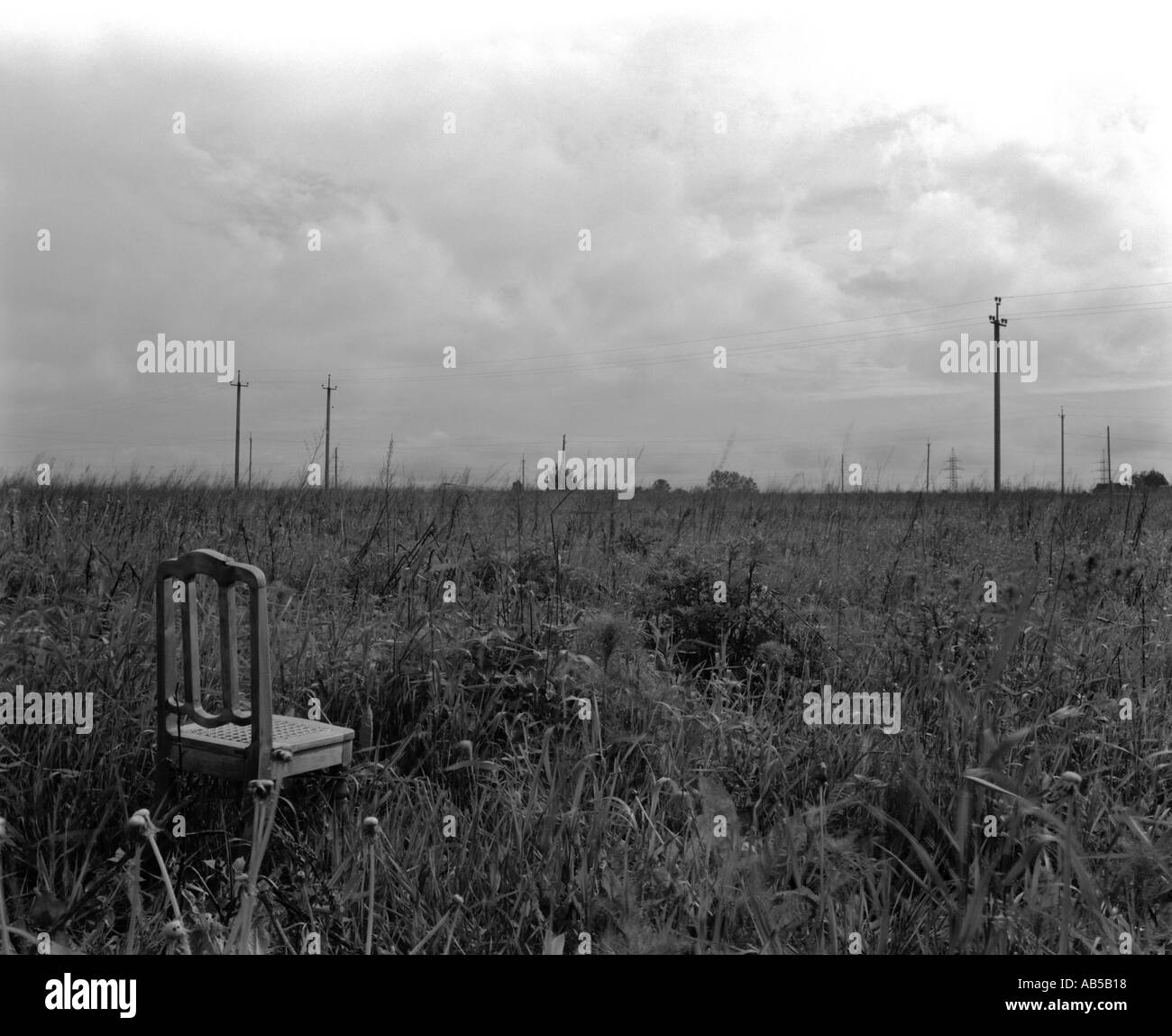 wooden chair in a grass field Stock Photo - Alamy