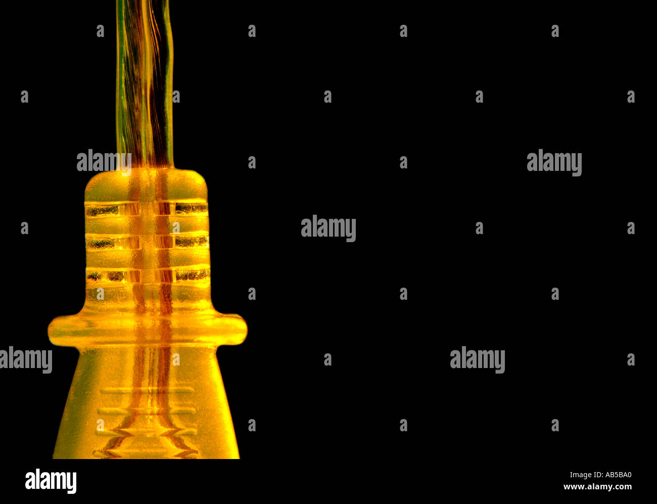 Yellow orange electrical plug , horizontal image, subject flush left ...