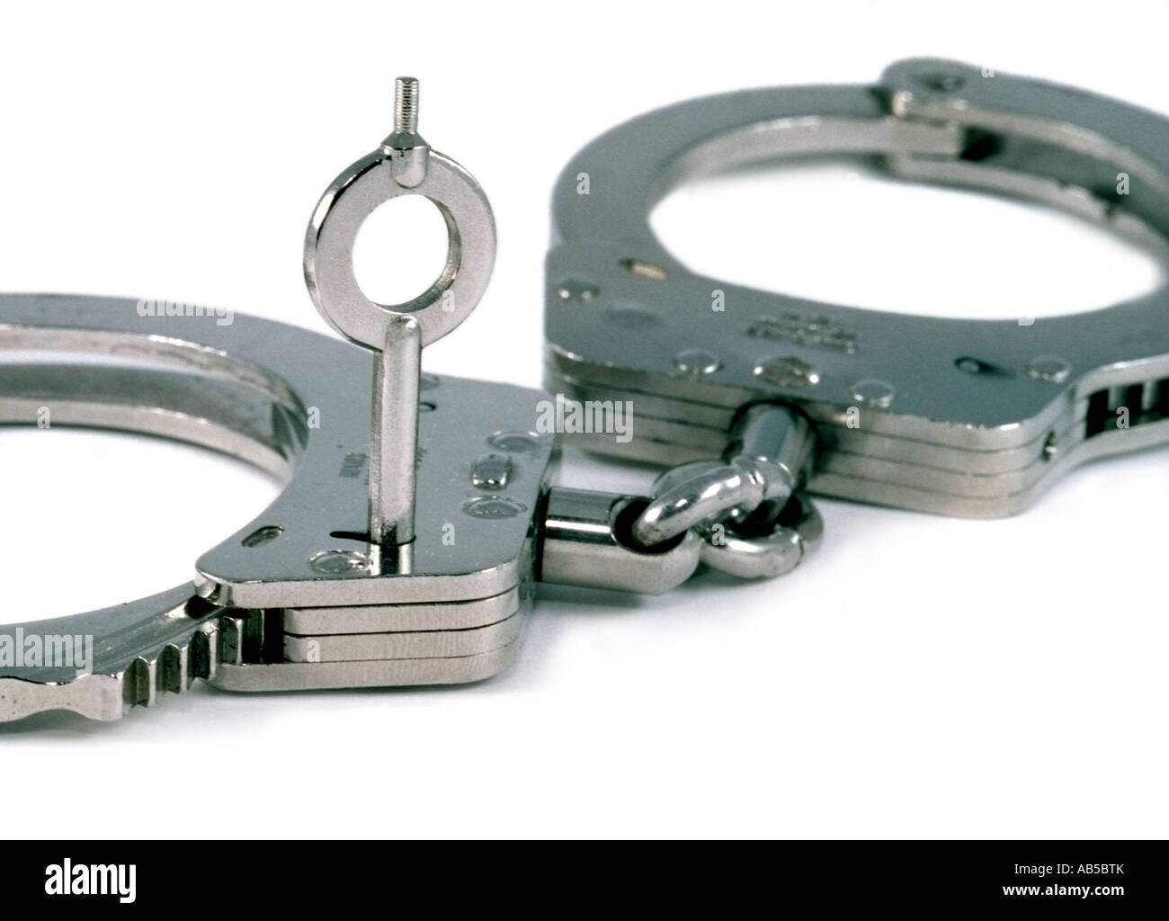 Close up of handcuffs and key Stock Photo - Alamy