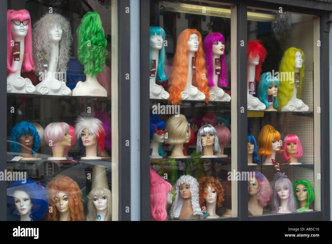 Wigs in Store Window Stock Photo - Alamy