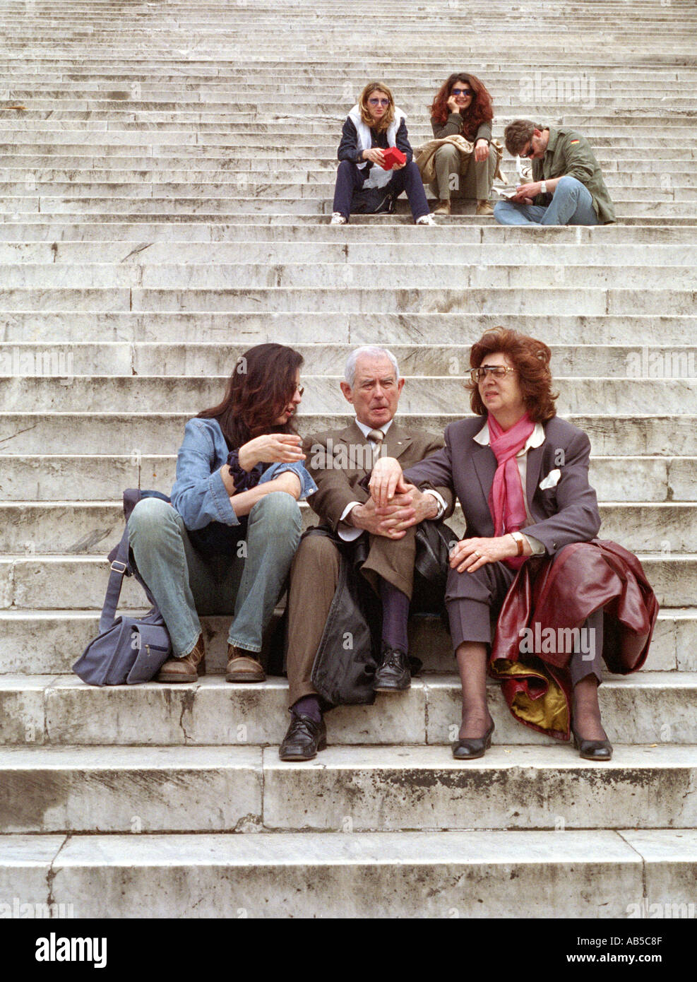 Tourist sitting on steps hi-res stock photography and images - Alamy