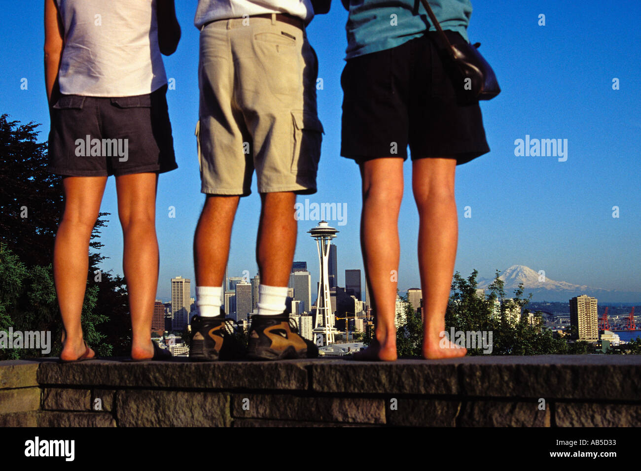 College Students With Shorts And Bare Legs Stand On Stone Railing To ...