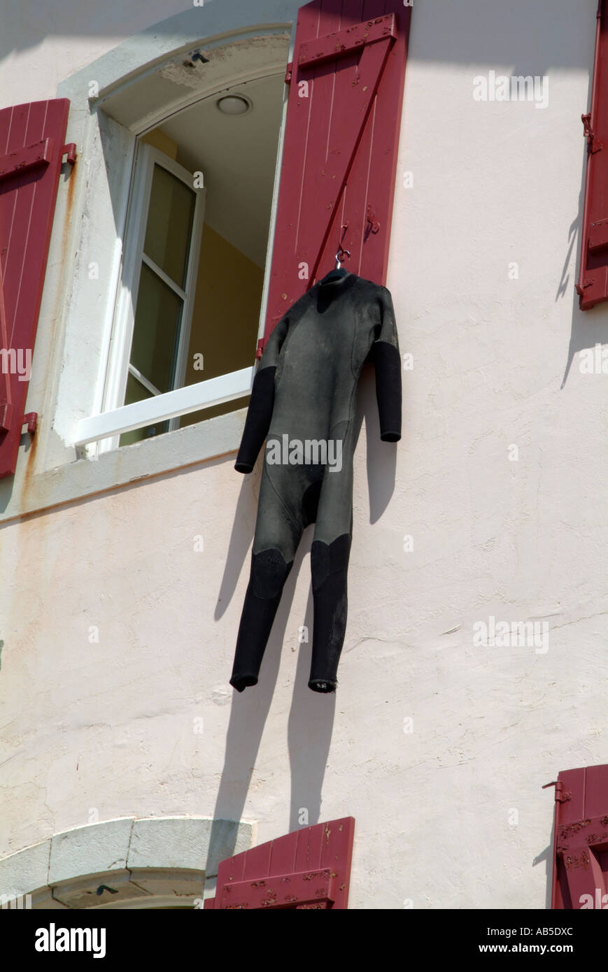 Wetsuit drying hi-res stock photography and images - Alamy