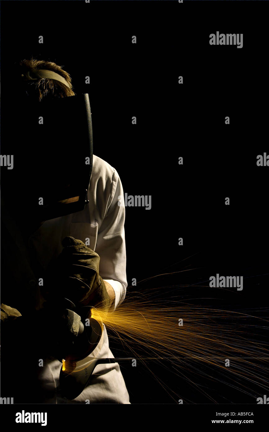 Subject griding a golf club with an angle grinder Stock Photo - Alamy