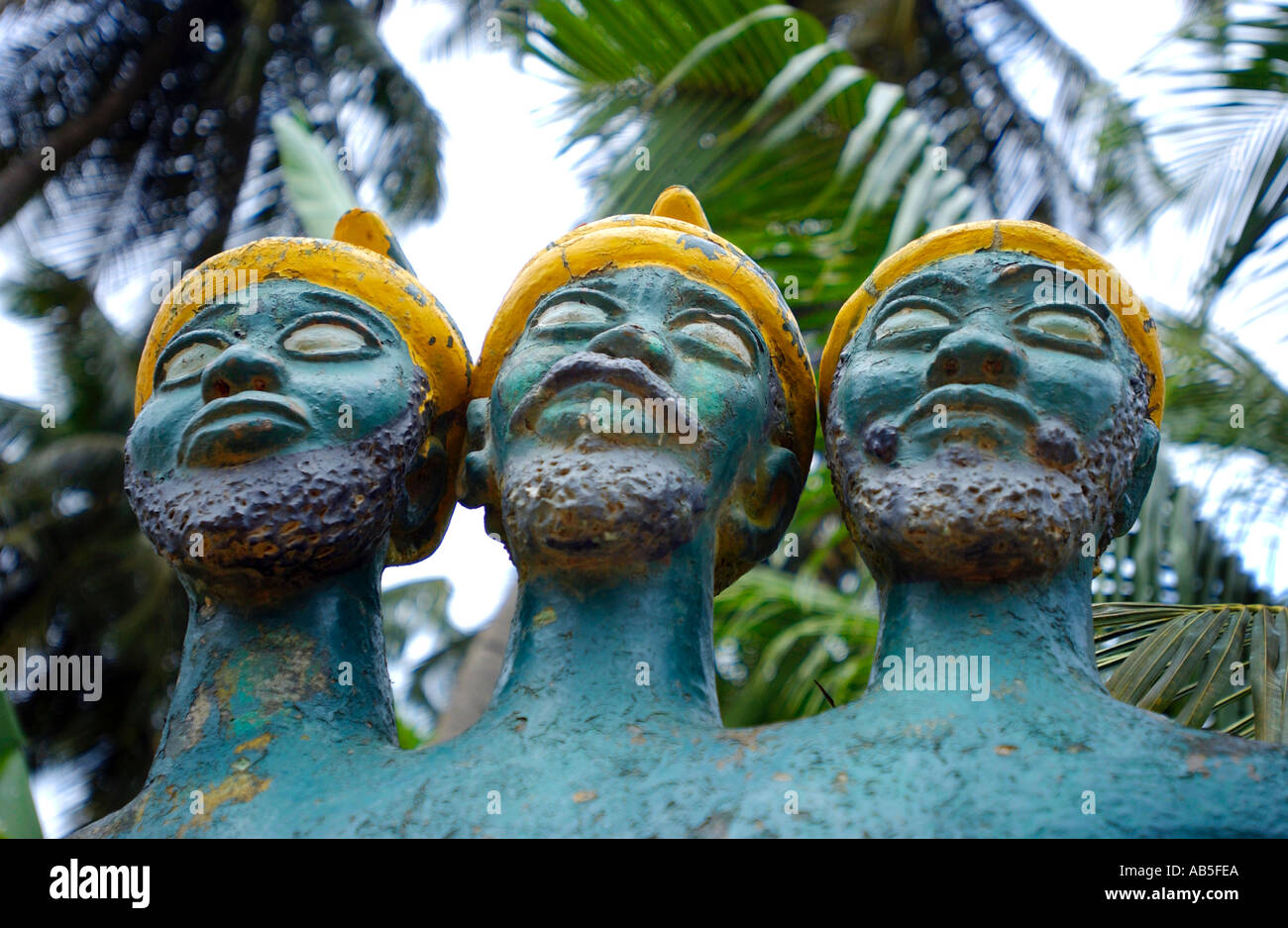A three headed statue lines the Route des Esclaves as it proceeds ...