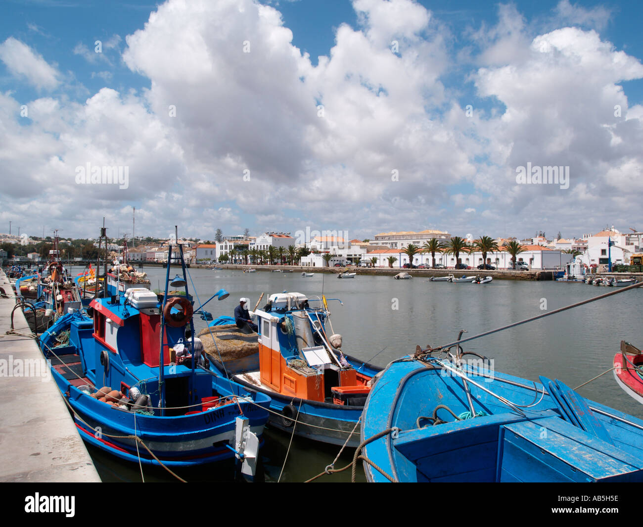 FISHING BOATS MOORED on RIO GILAO the wide tidal river which runs ...