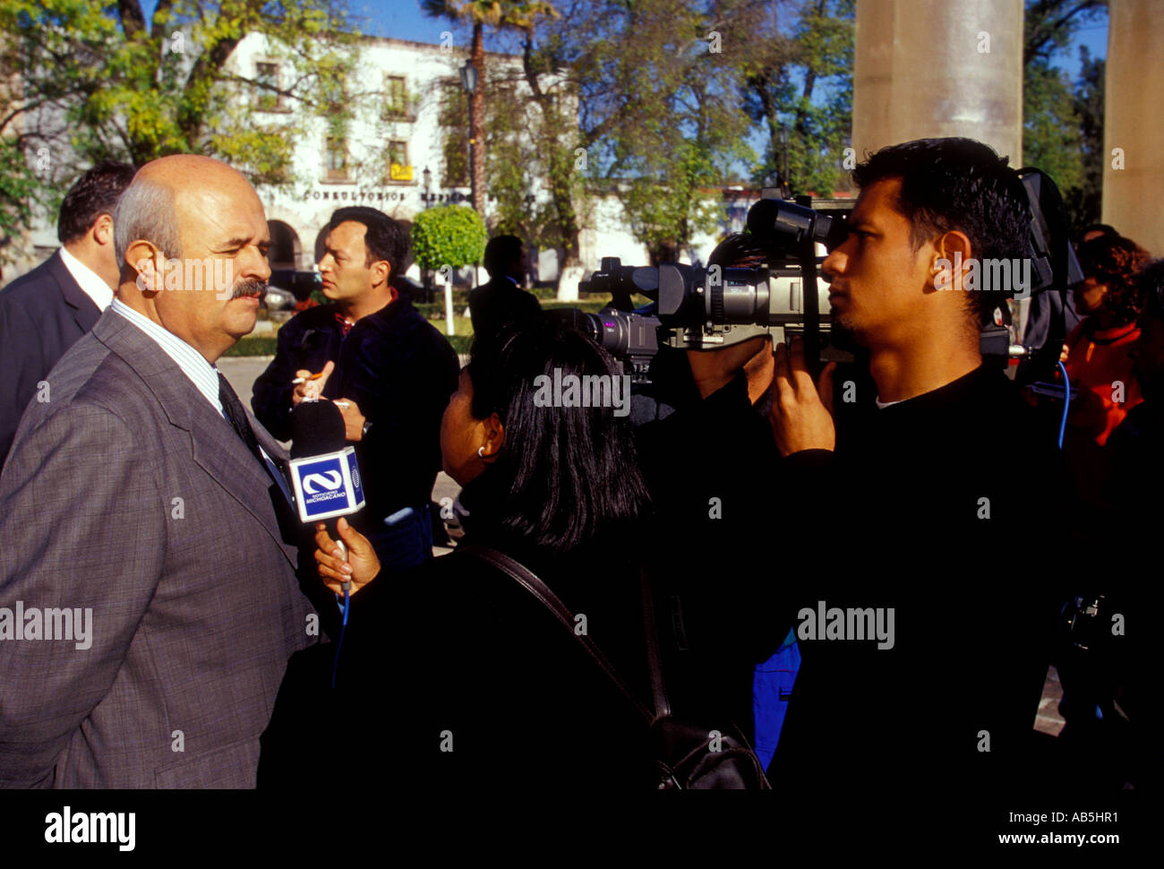Mexican woman, female reporter, journalist, conducting interview ...