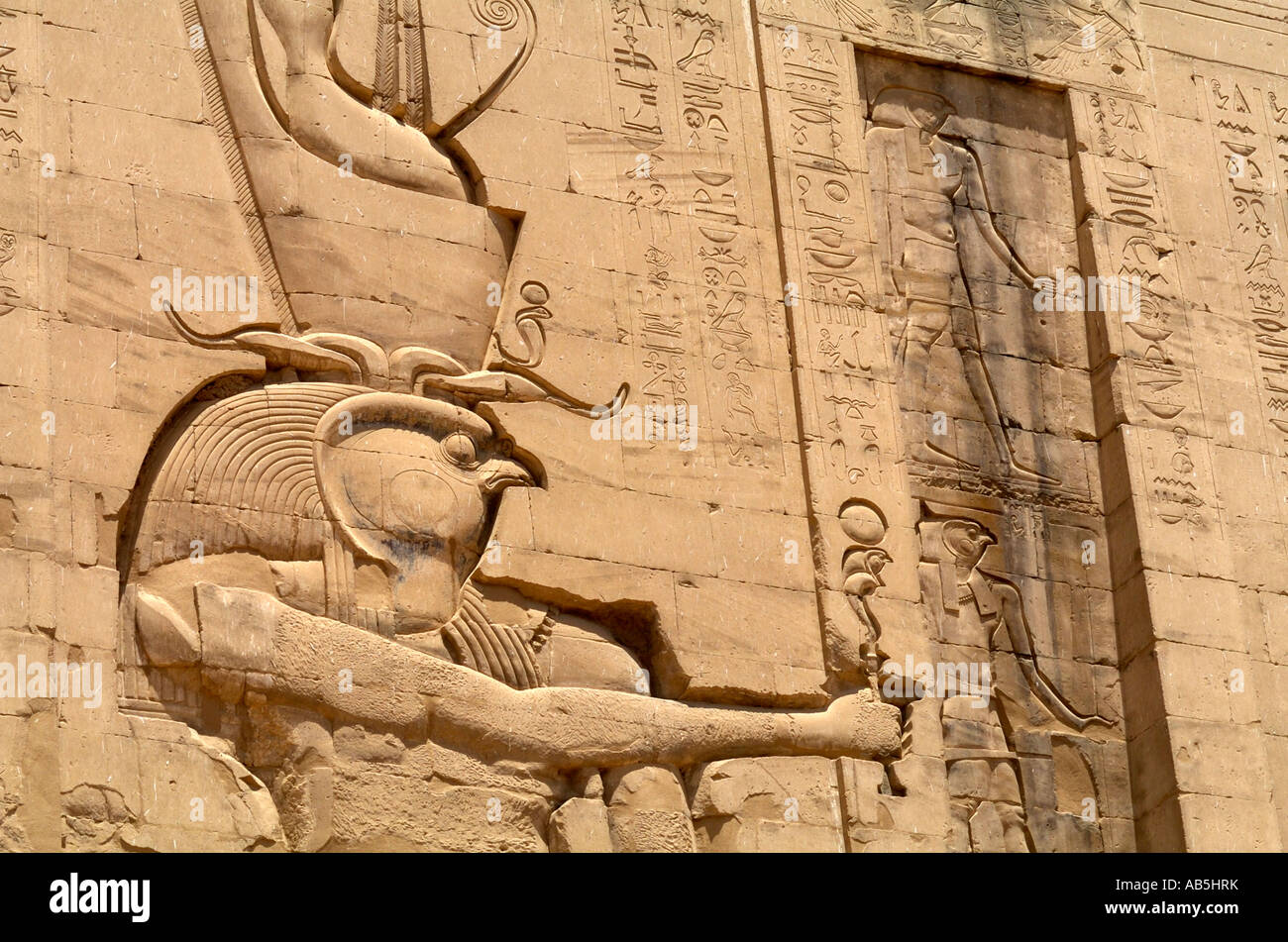 Relief carving of the falcon god Horus with the double crown of Egypt ...