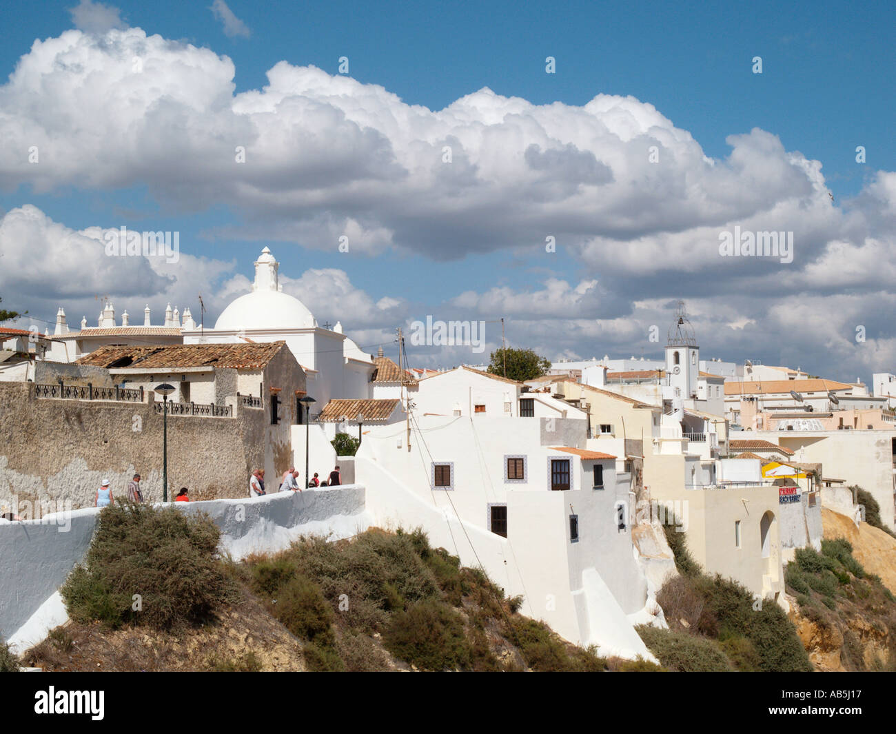 WHITE BUILDINGS of the OLD TOWN and walkway on the cliff Albufeira ...