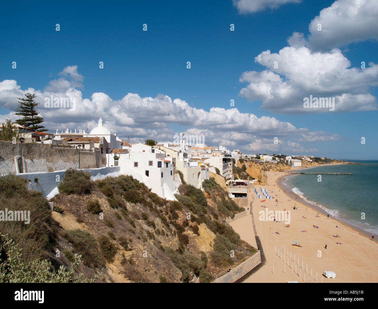 WHITE BUILDINGS of the OLD TOWN on the sandstone cliffs. Albufeira ...