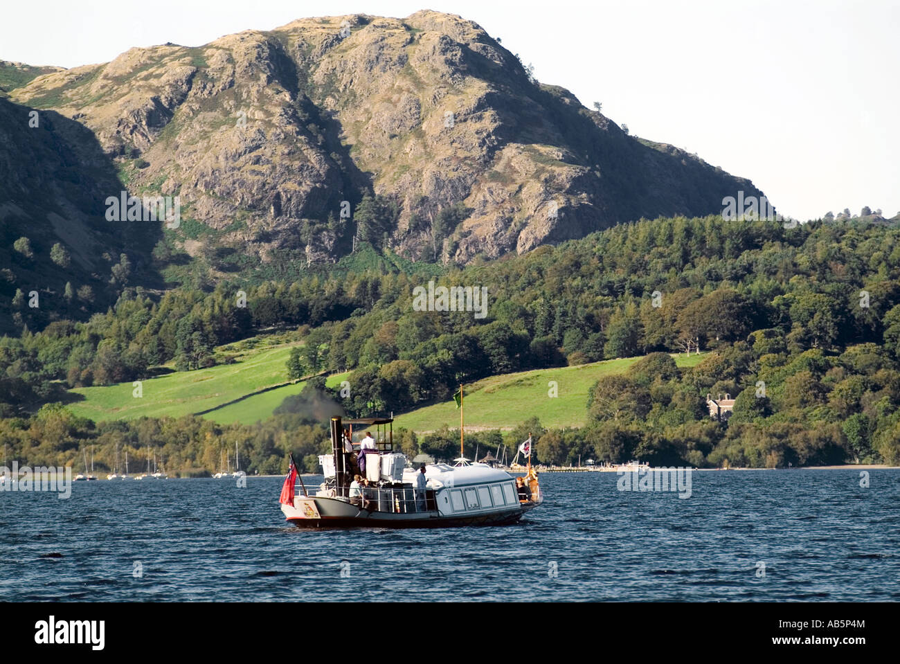 A lake district steamer sails across lake coniston in lovely summer ...