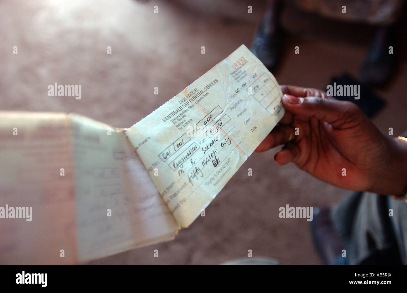 A funeral card showing weekly payments of an elderly woman for her ...