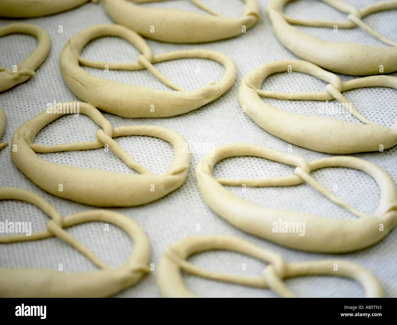 bakery baking bread brezels in small commercial kitchen placed on ...