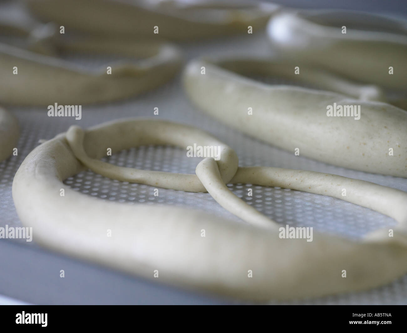 bakery baking bread brezels in small commercial kitchen placed on ...