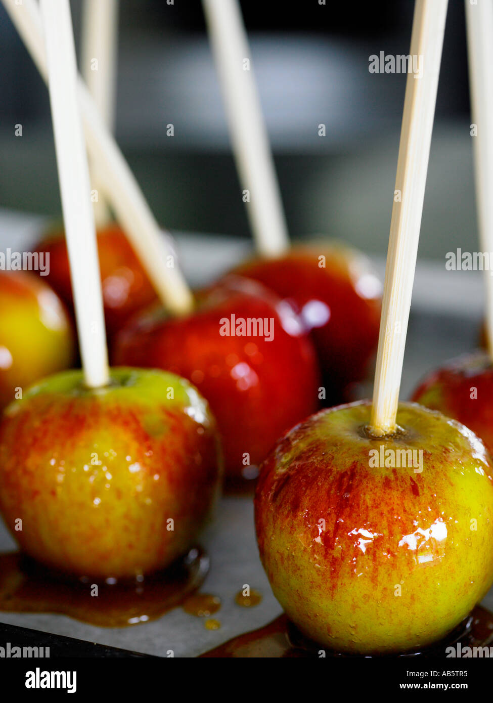 home made toffee apples drying on grease proof paper Stock Photo - Alamy