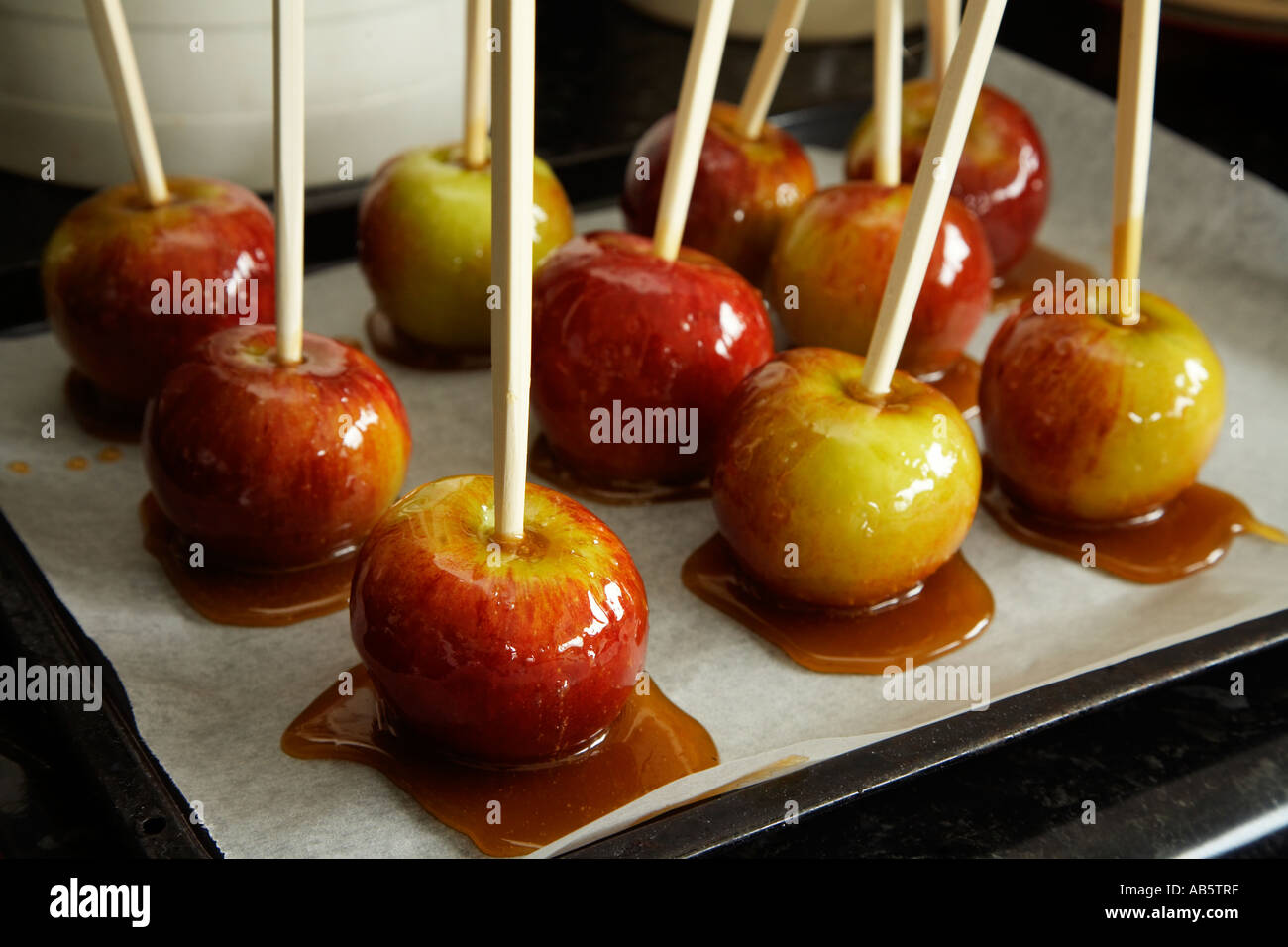 home made toffee apples drying on grease proof paper Stock Photo - Alamy