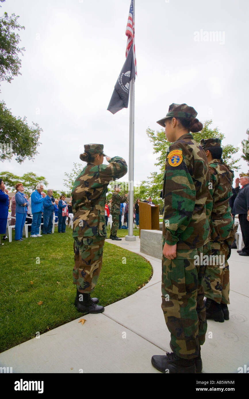 Teenage Young Marines salute flags on Memorial Day Stock Photo - Alamy