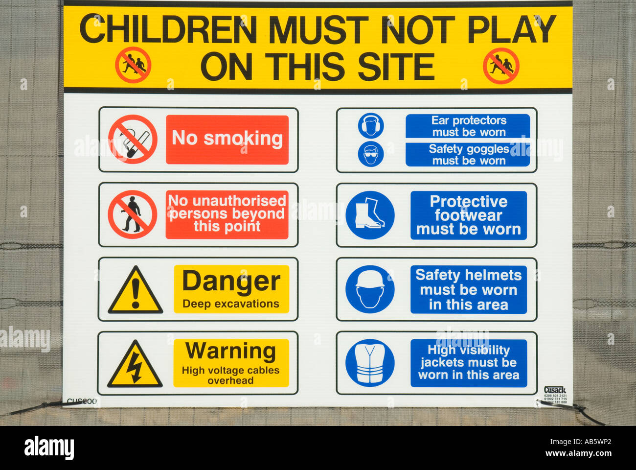Sign on fence outside building site warning children and listing site ...