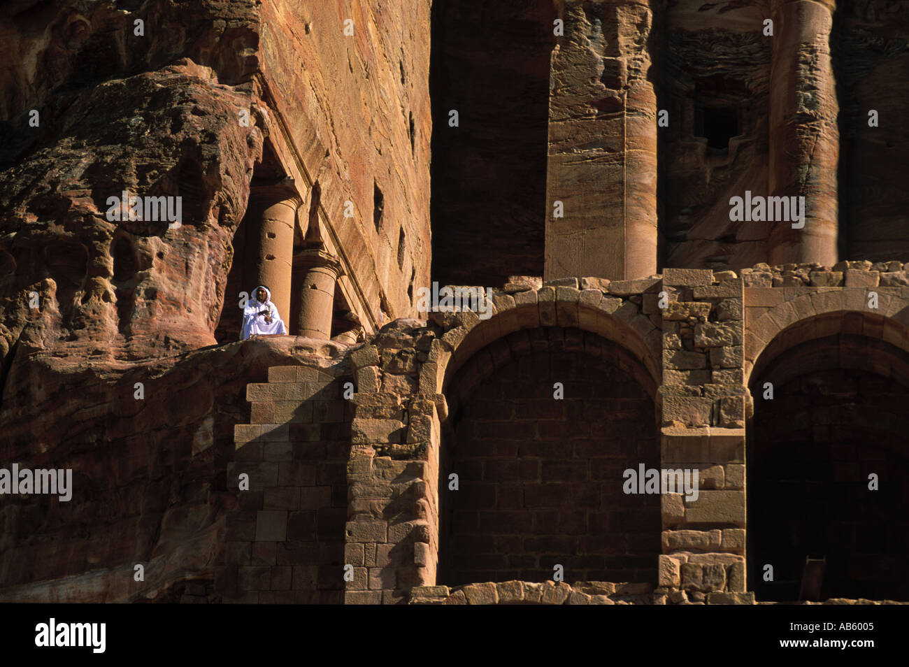 Jordan Petra arab Man in traditional white garb sitting in front of ...