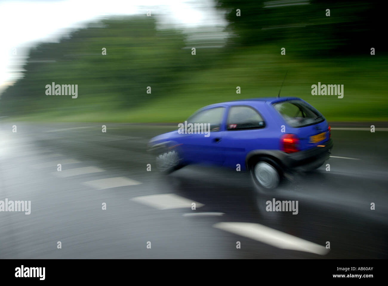 Fast moving car Stock Photo - Alamy