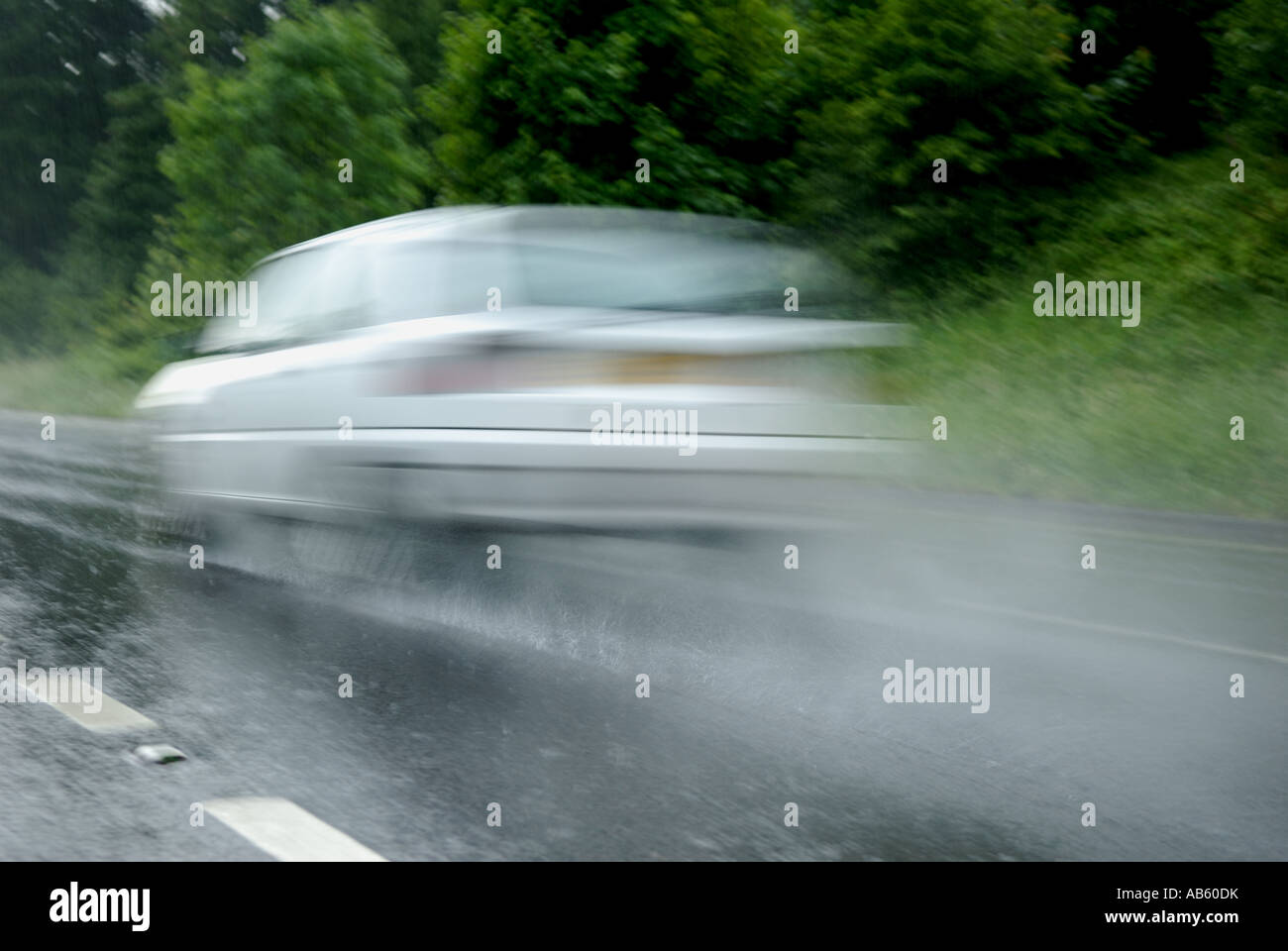 Car driving on very wet road surface Stock Photo - Alamy