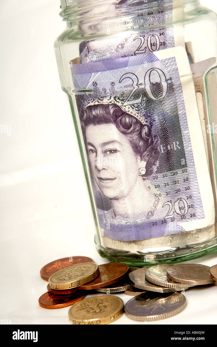 Cash in jar Stock Photo - Alamy
