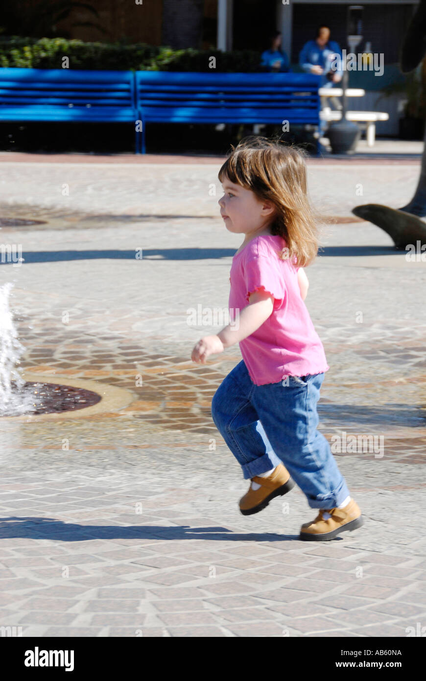 Small girl running Stock Photo - Alamy