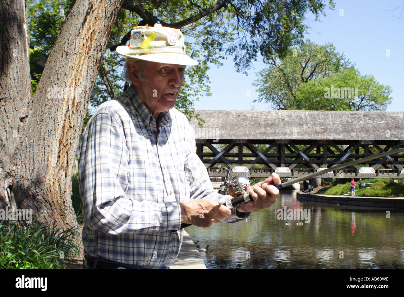 Old man is fishing Stock Photo - Alamy