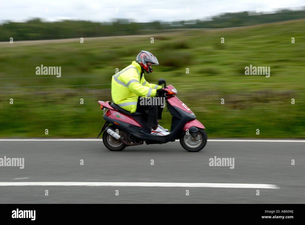 Man on moped/scooter Stock Photo - Alamy