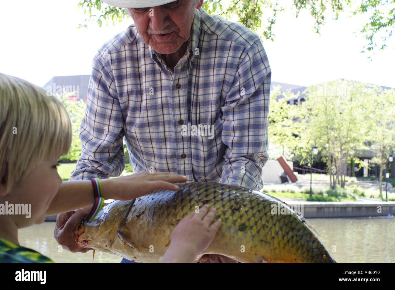 Senior man fishing with kid hi-res stock photography and images - Alamy