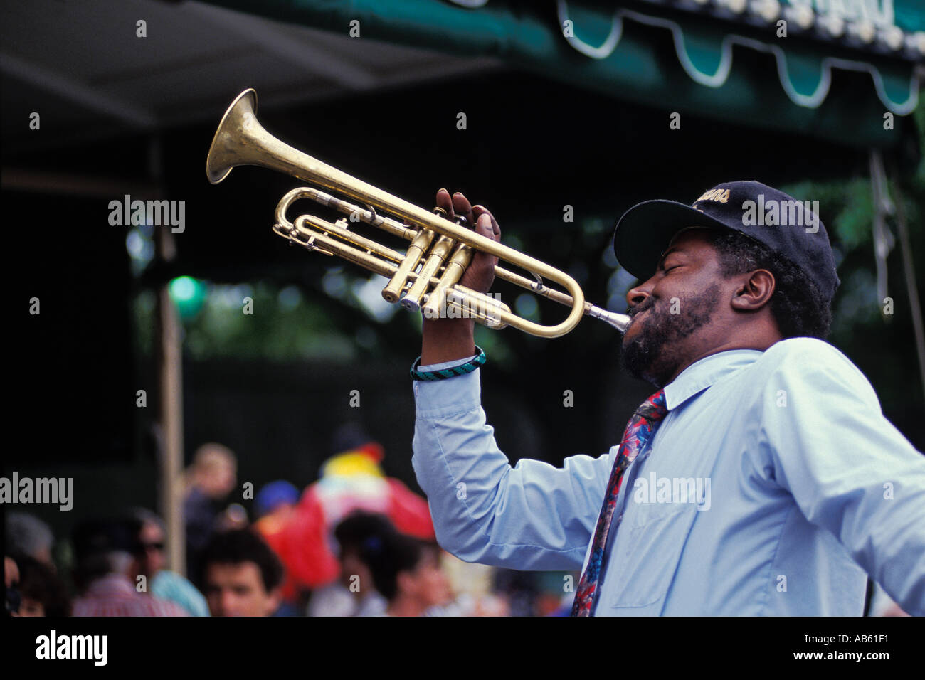Louisiana New Orleans French Quarter Cafe du Monde street musician playing trumpet outside ...