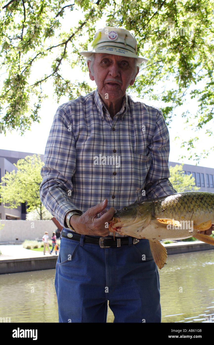 Old man holding big fish hi-res stock photography and images - Alamy