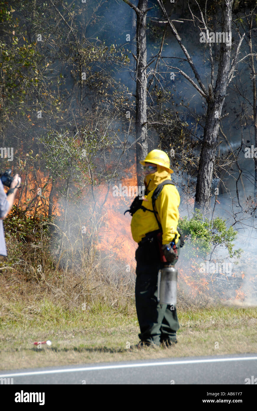 Firemen use a controlled burn technique to clear dead underbrush from ...