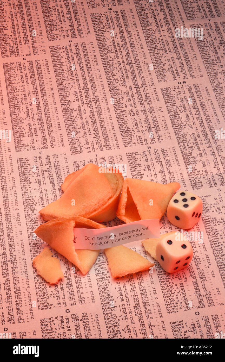 Fortune cookies dice and stock market investment tables Stock Photo - Alamy