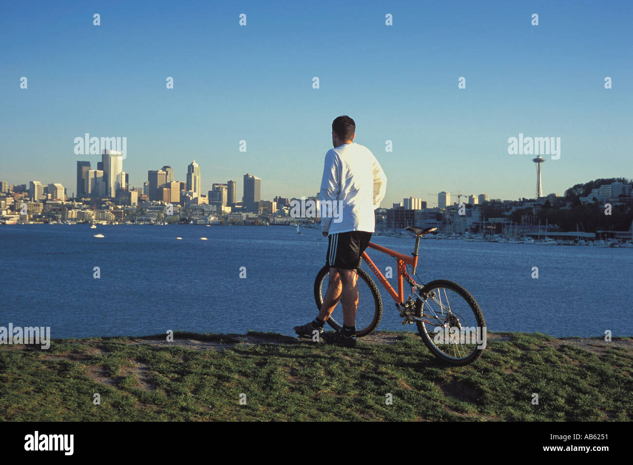 Bicyclist Atop Gasworks Park Views Lake Union And Seattle Washington ...