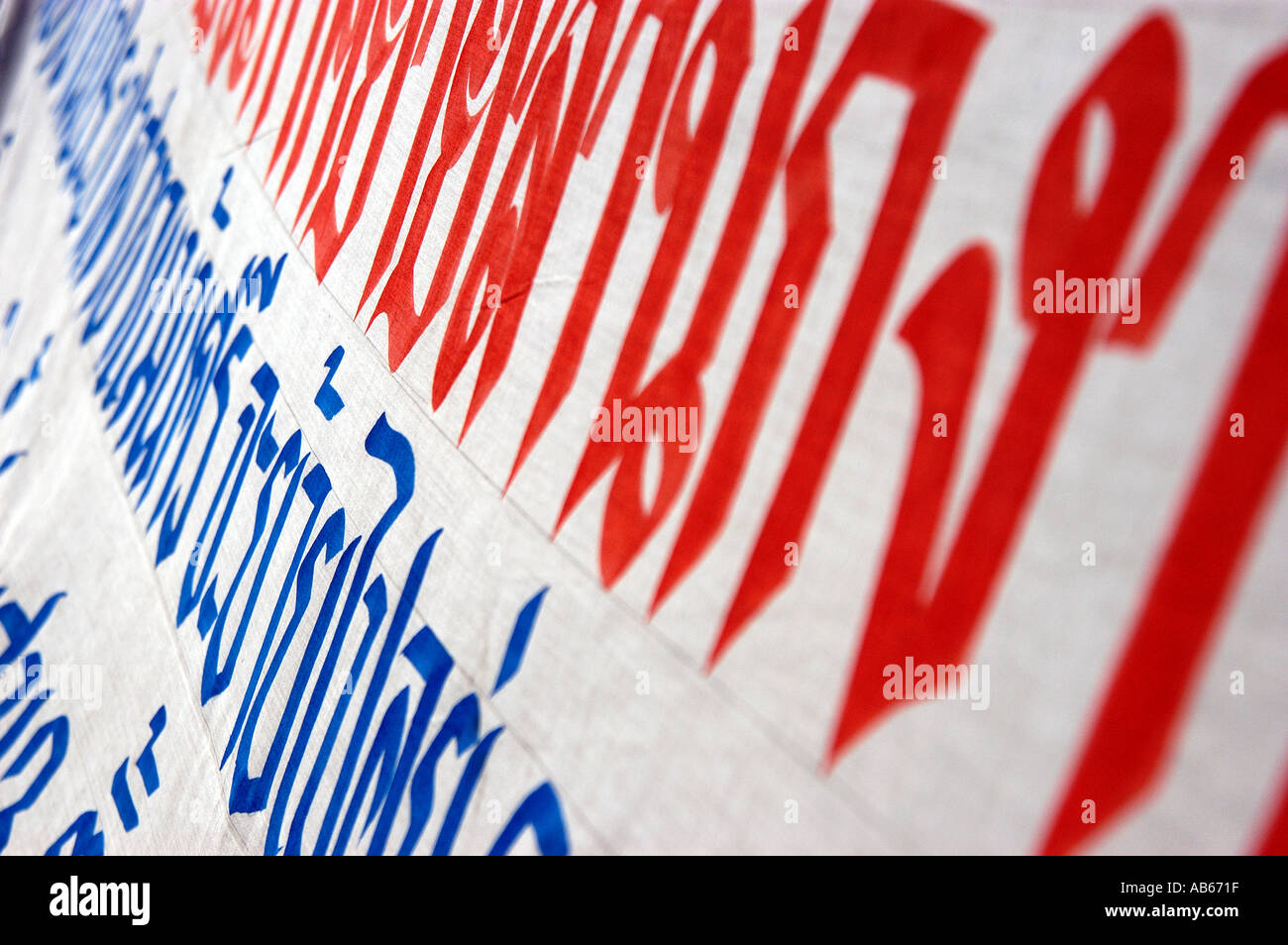 Large hanging banner written in blue and red Thai characters. Bangkok ...