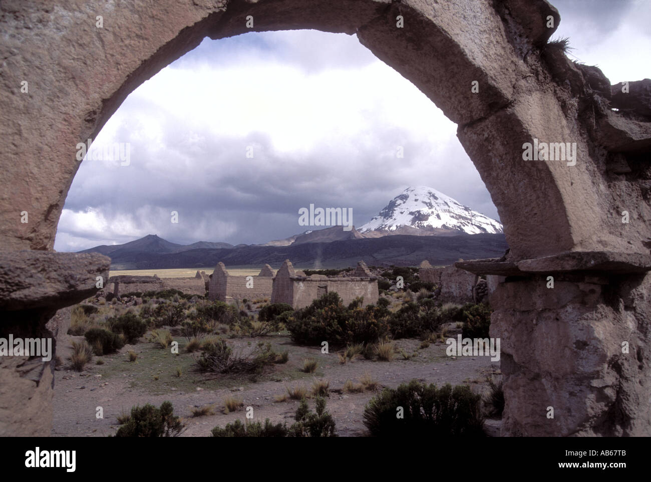 Mount Sajama volcano through stone gate, Sajama, Altiplano Bolivia ...