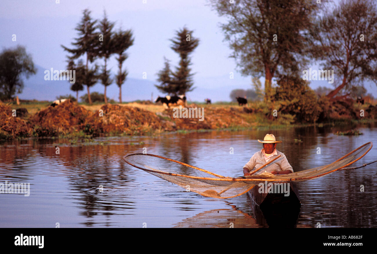 man with butterfly net for catching white fish on lake patzcuaro mexico ...