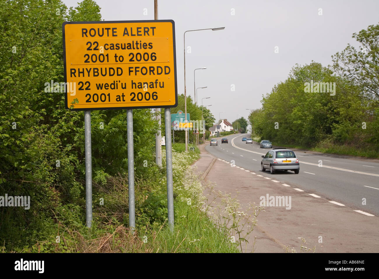 Traffic and bilingual dual language sign at traffic black spot Cardiff ...