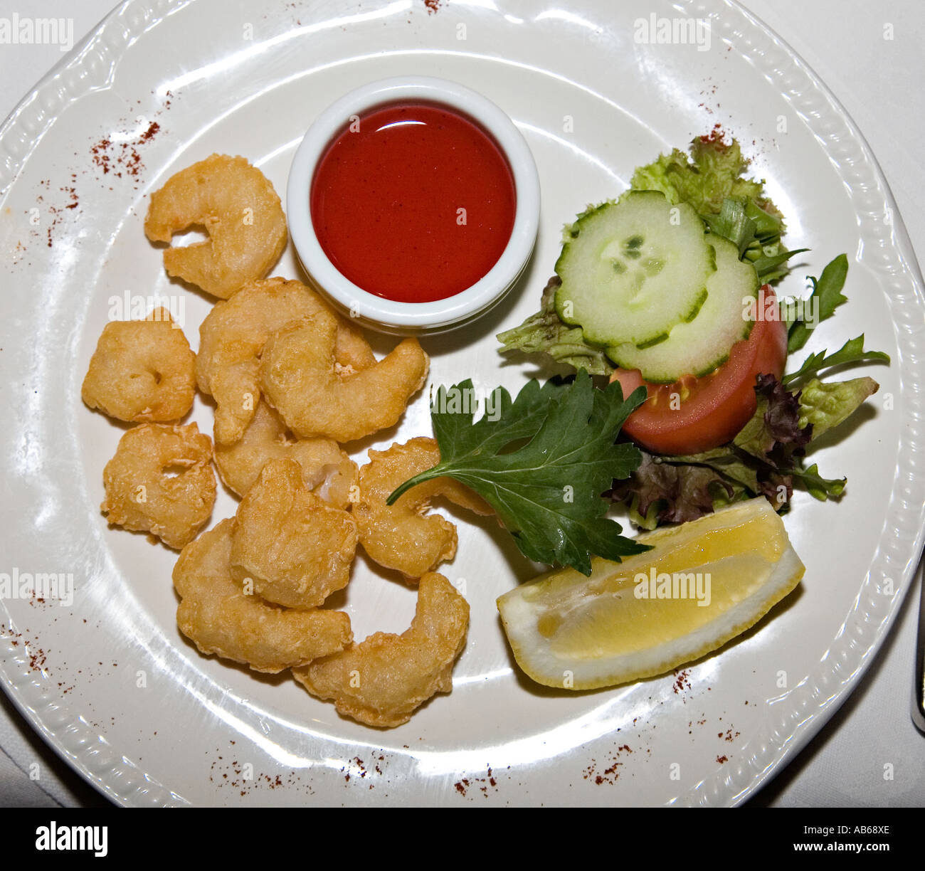 Starter plate of deep fried prawns with salad lemon and dip Wales UK ...
