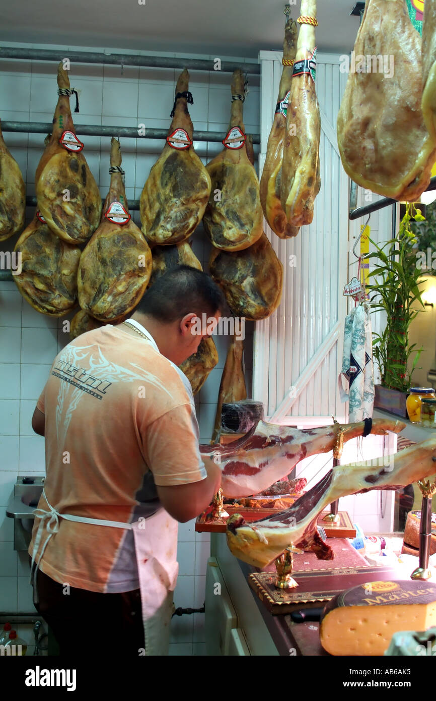 Butcher cutting a Serrano ham Shop in Southern Spain Europe EU Stock ...