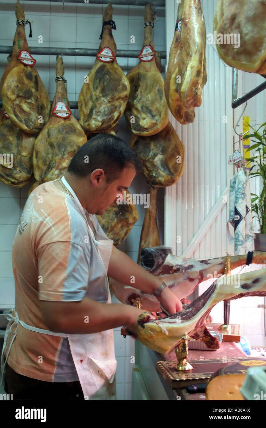 Butcher cutting a Serrano ham Shop in Southern Spain Europe EU Stock ...