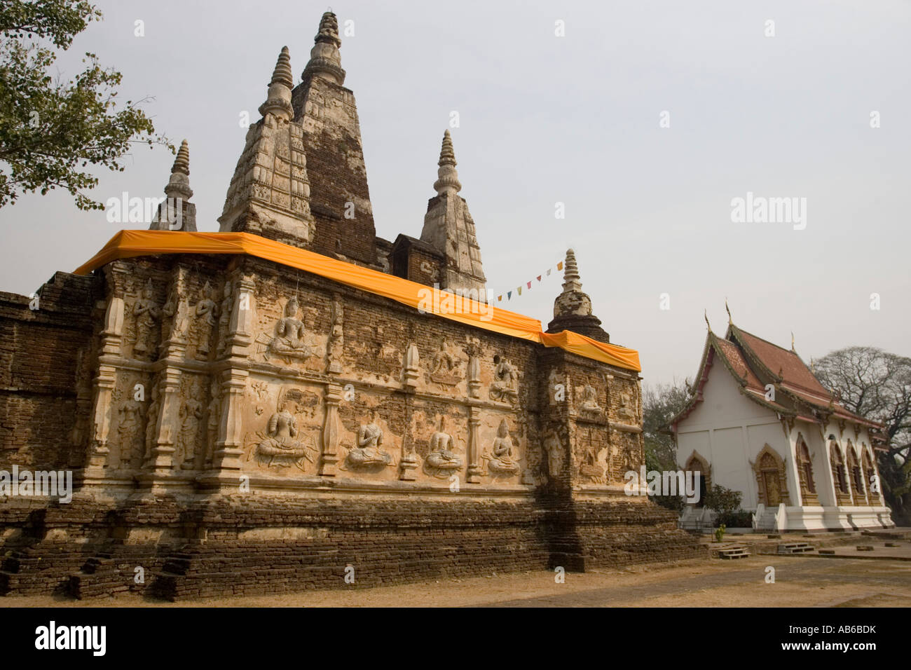 Holy saffron wrap around Buddhist mural chedis Wat Chet Yod Chiang Mai ...